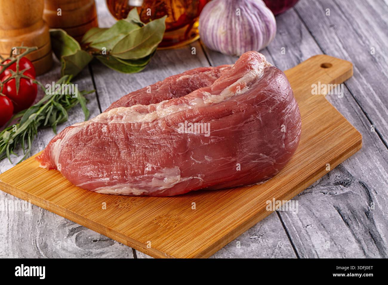 Raw pork sirloing over board for cooking Stock Photo - Alamy