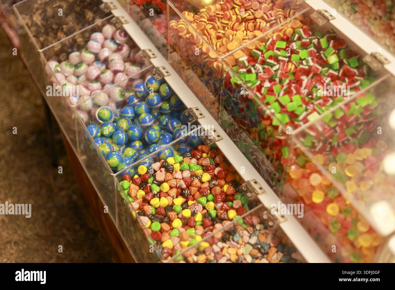 Colorful candy selection in clear bin at sweet shop with sugary treat ...