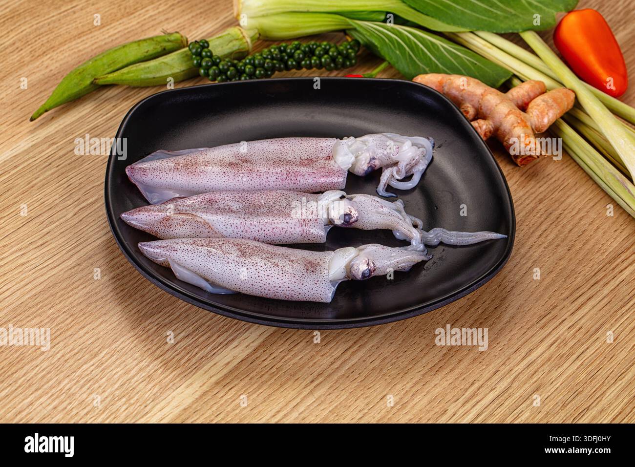 Raw fresh young calamari or squid for cooking Stock Photo - Alamy