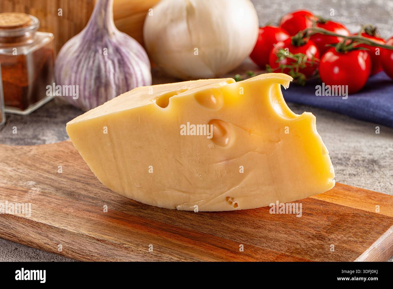 Yellow maasdam cheese triangle piece for breakfast Stock Photo - Alamy