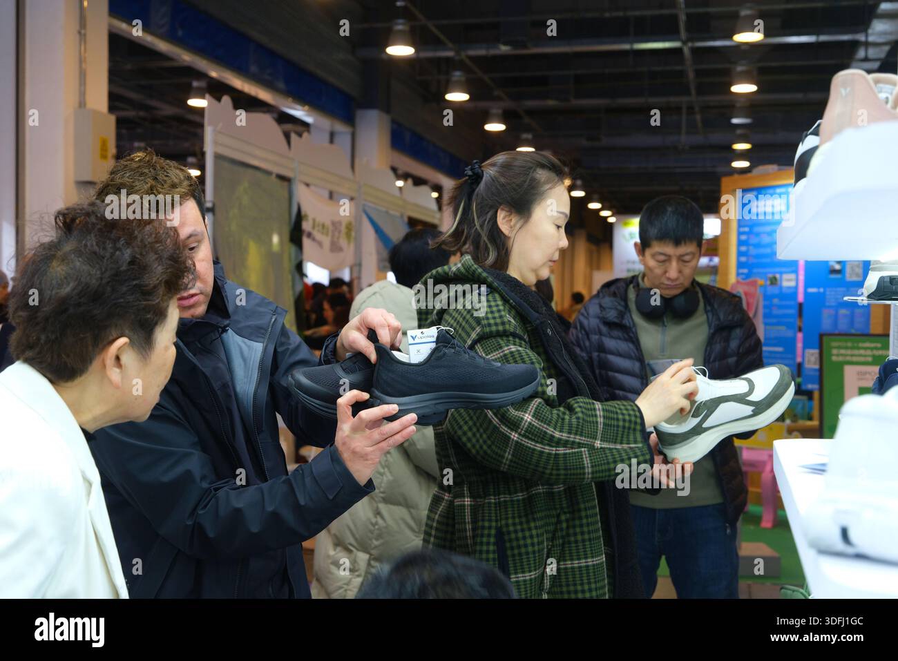 Visitors tour the ISPO Beijing 2026 exhibition at China National ...