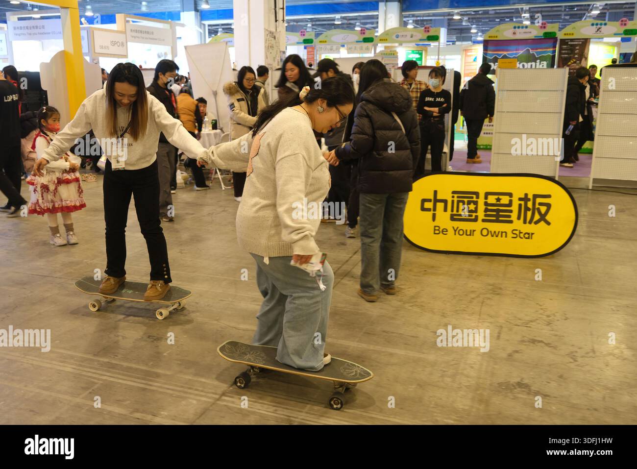 Visitors tour the ISPO Beijing 2026 exhibition at China National ...