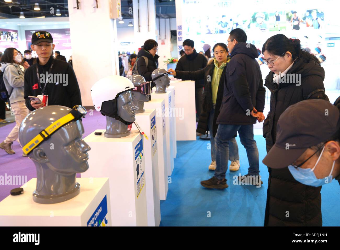 Visitors tour the ISPO Beijing 2026 exhibition at China National ...