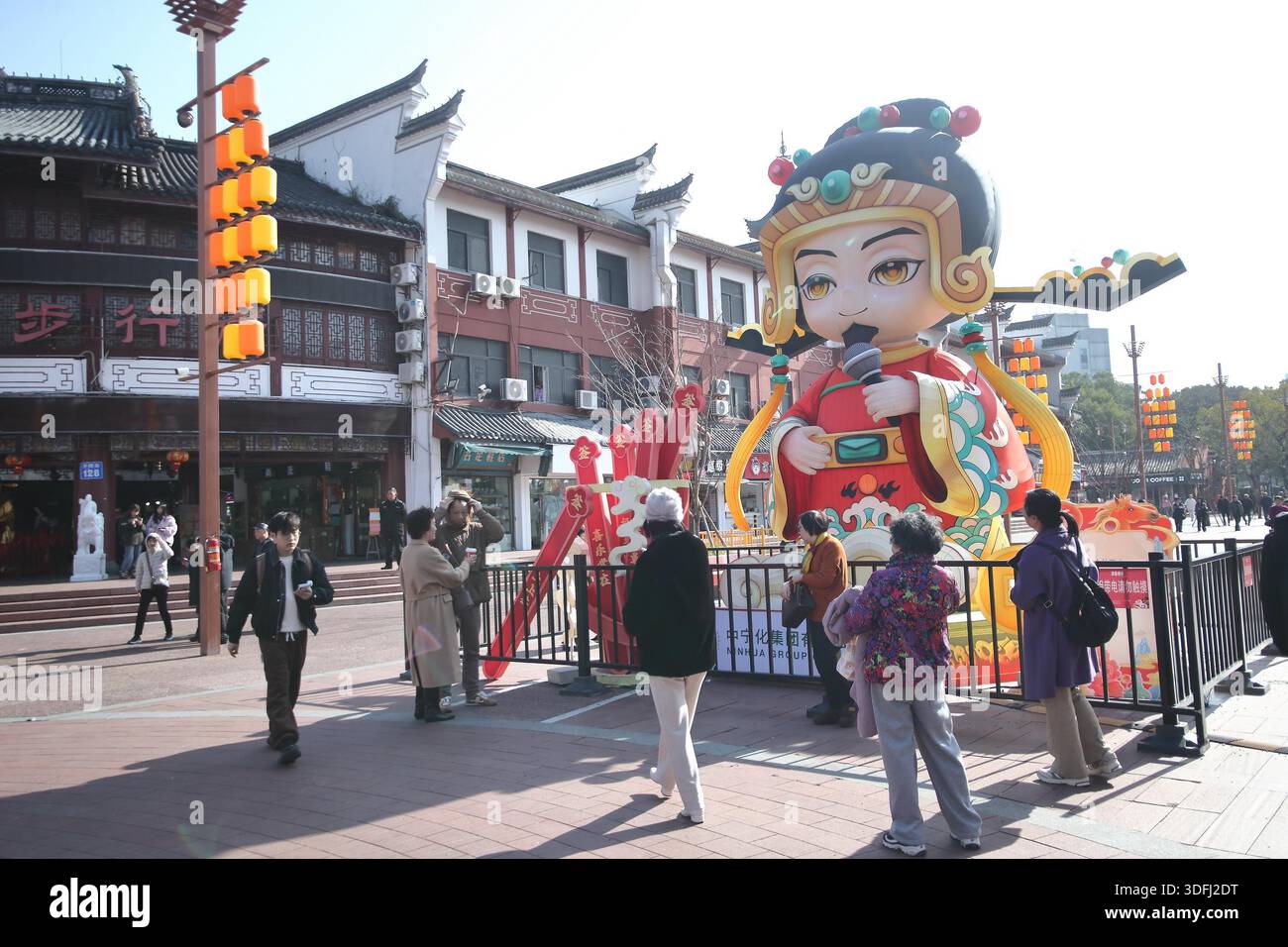 Visitors admire Lunar New Year lantern displays at Chenghuang Temple ...