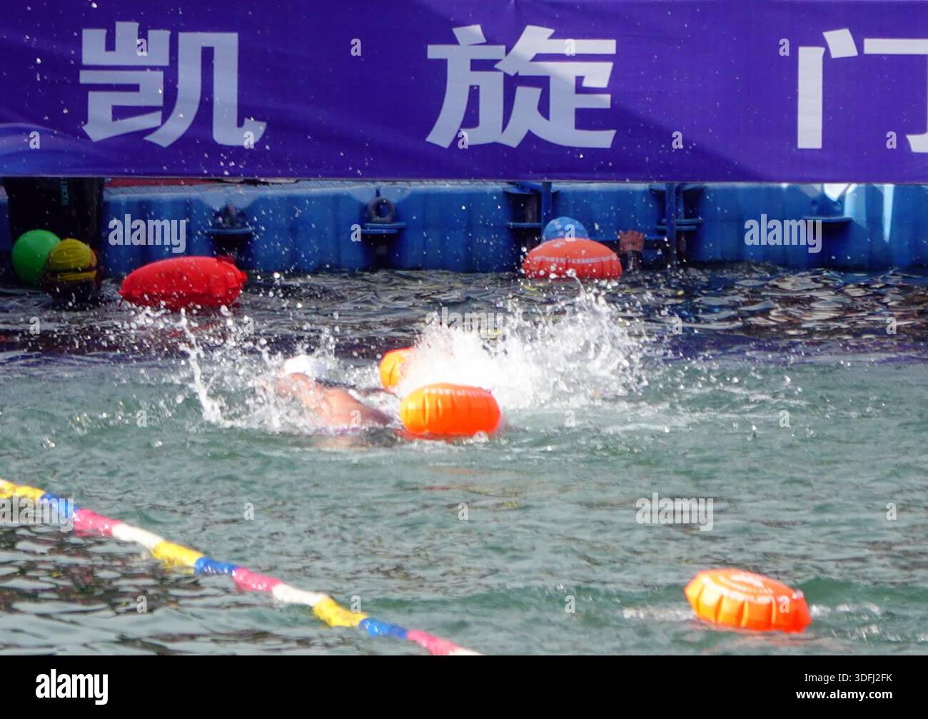 Participants compete during the 6th Huangbai River Winter Swimming ...