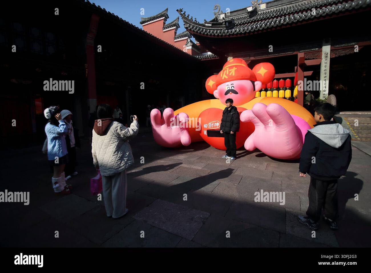 Visitors admire Lunar New Year lantern displays at Chenghuang Temple ...