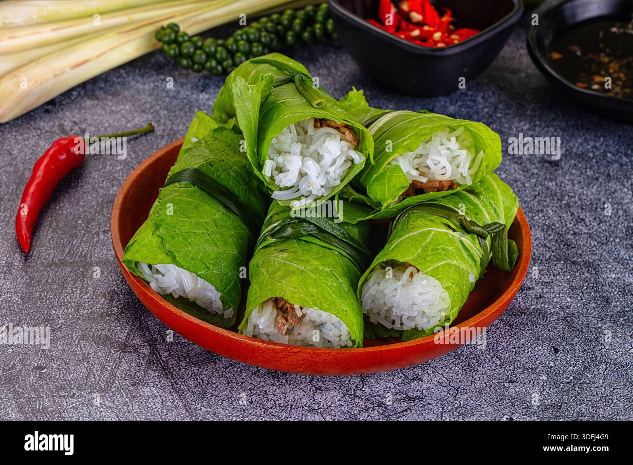 Vietnamese stuffed green nem spring rolls in leaf Stock Photo - Alamy