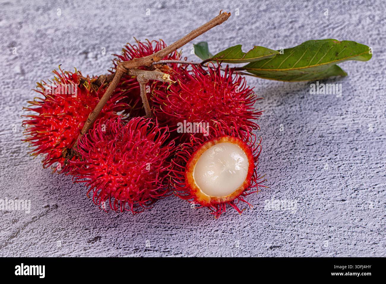 Sweet ripe juicy haired rambutan fruit Stock Photo - Alamy