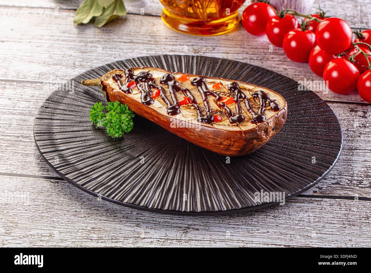 Baked eggplant half with teriyaki sauce Stock Photo - Alamy