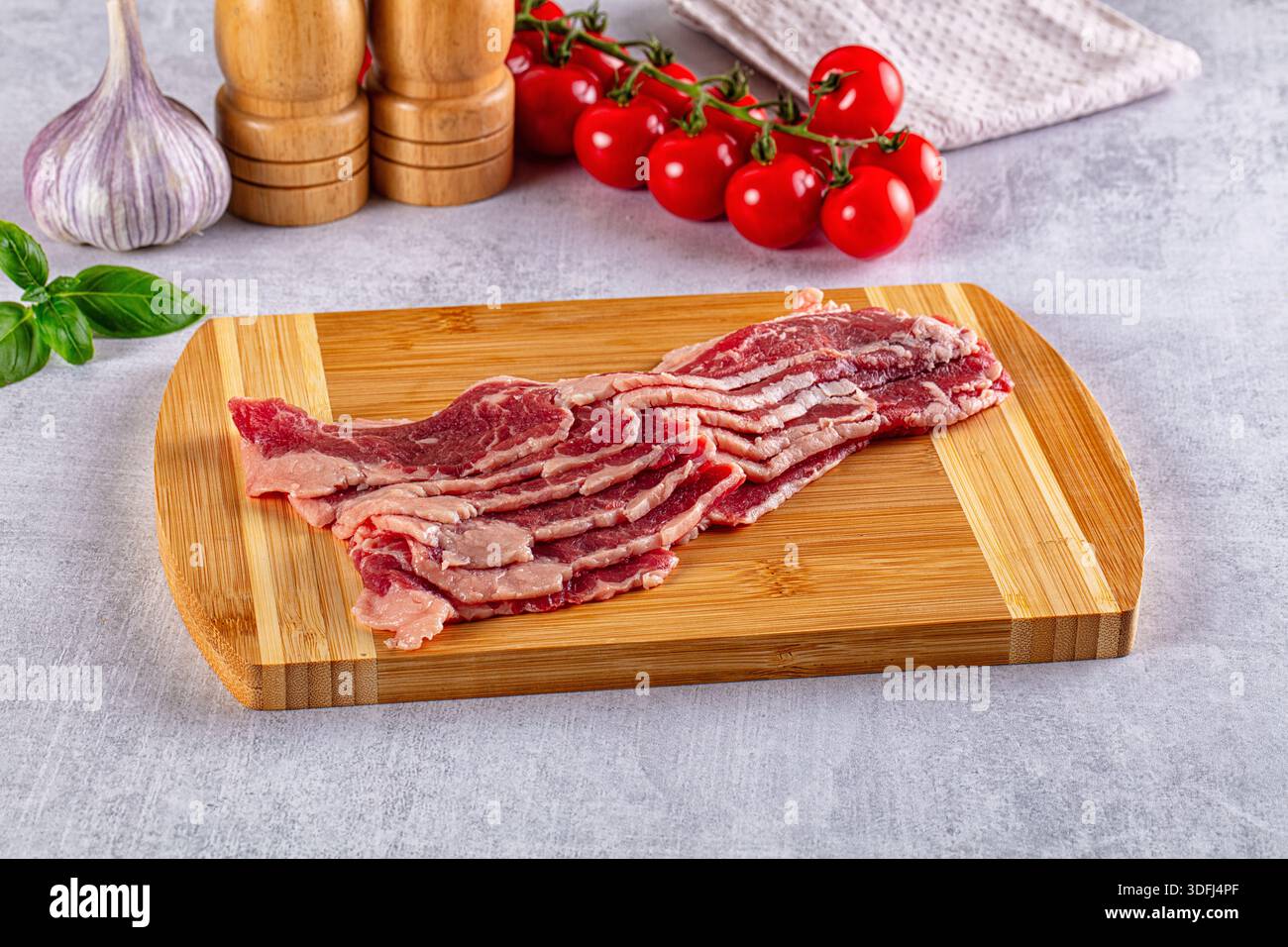 Raw beef marble bacon slices over board Stock Photo - Alamy