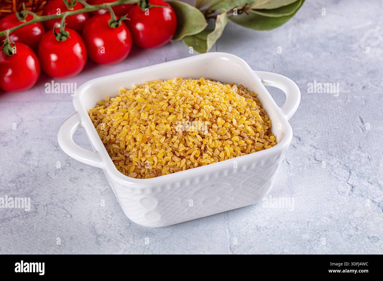 Raw dry bulgur wheat cereal for cooking Stock Photo - Alamy