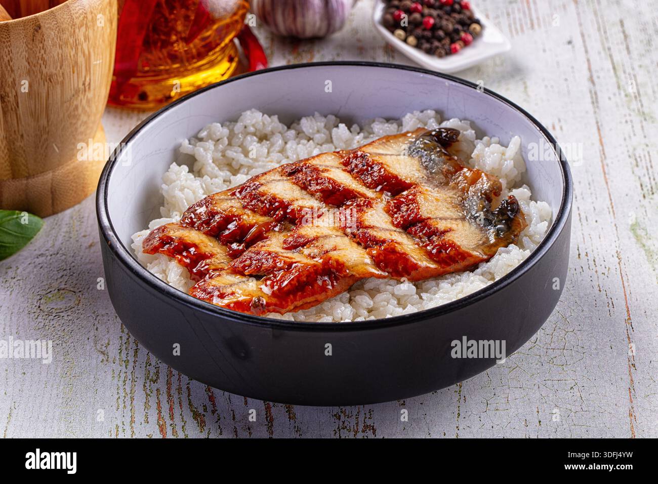 Japanese style cuisine - grilled eel with steamed rice and sauce Stock ...