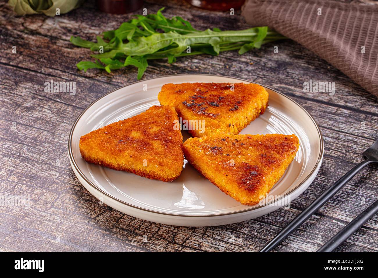 Fried golden fish cutlets triangles in the plate Stock Photo - Alamy