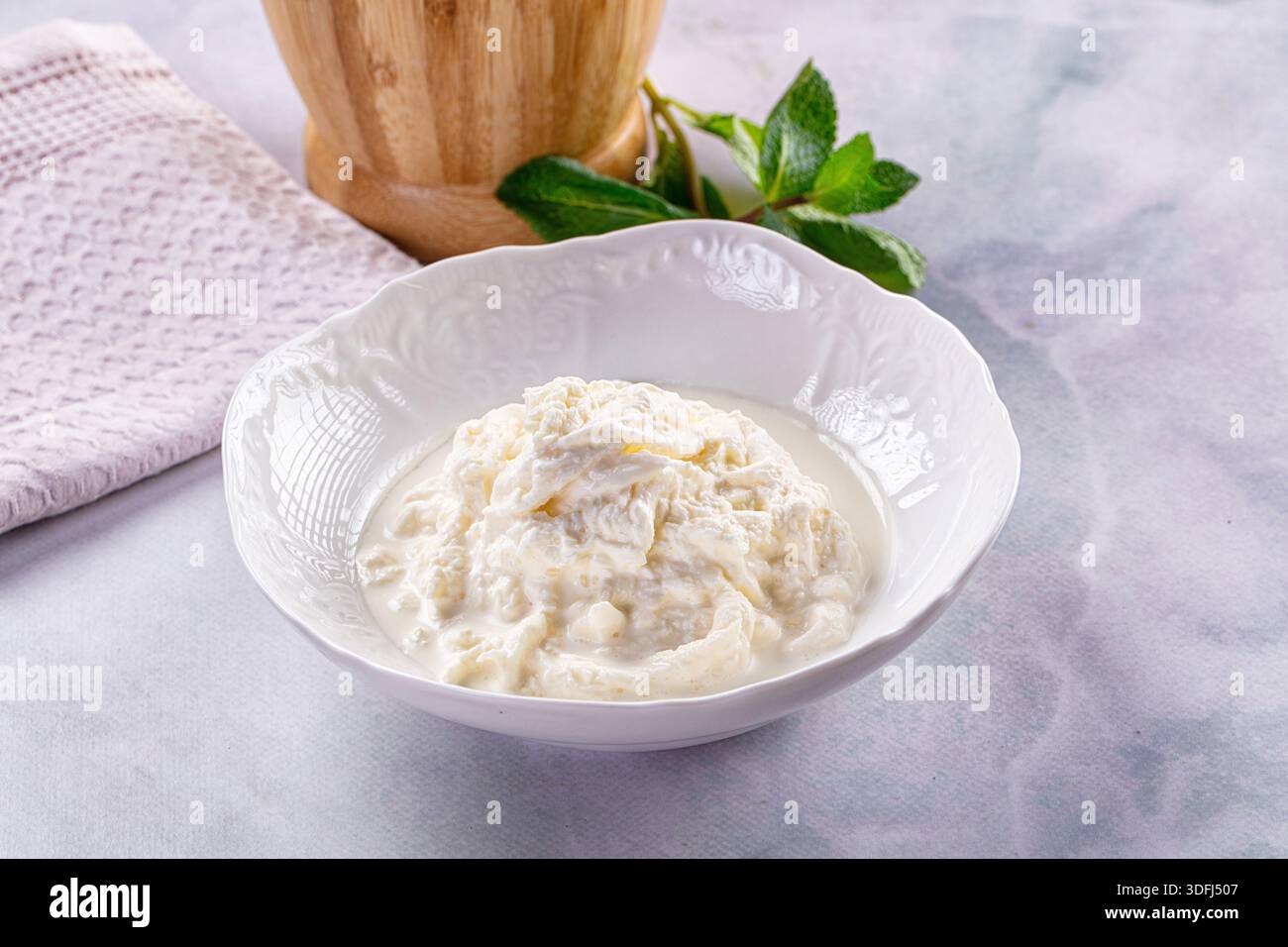 Italian soft young stracciatella creamy cheese Stock Photo - Alamy