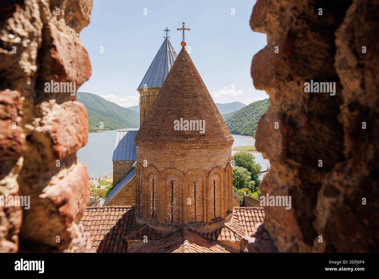 Scenic view of the church spire looking through the stone windows of ...