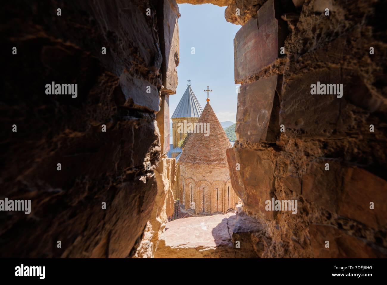 Scenic view of the church spire looking through the stone windows of ...