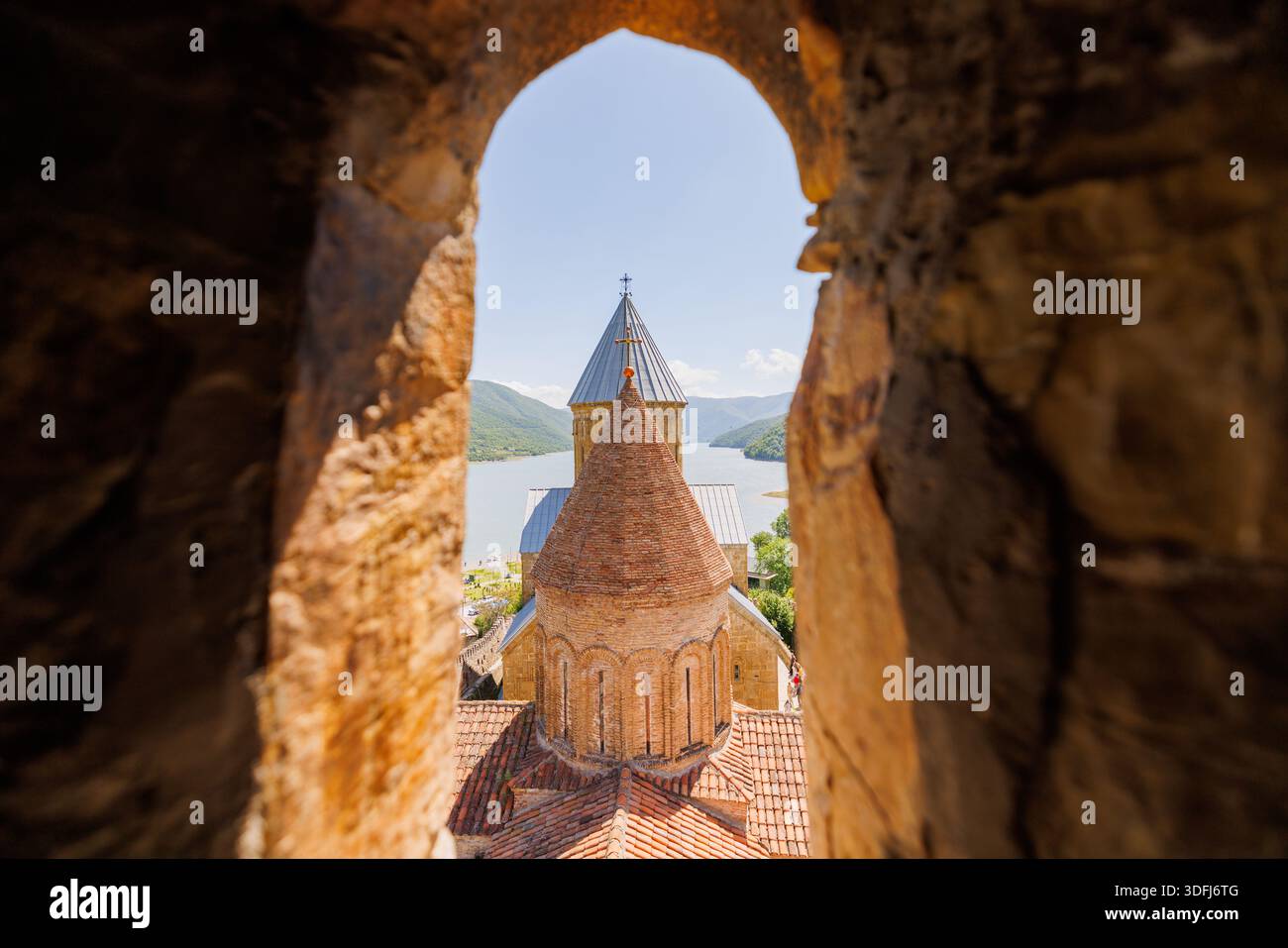 Scenic view of the church spire looking through the stone windows of ...