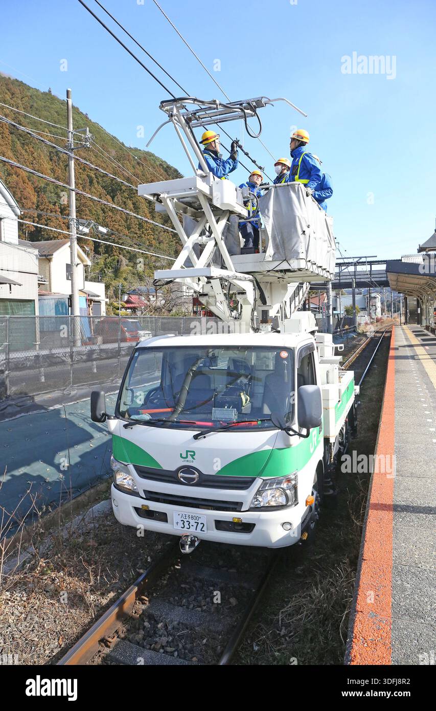 East Japan Railway Company Ome Line overhead wire inspection work is ...
