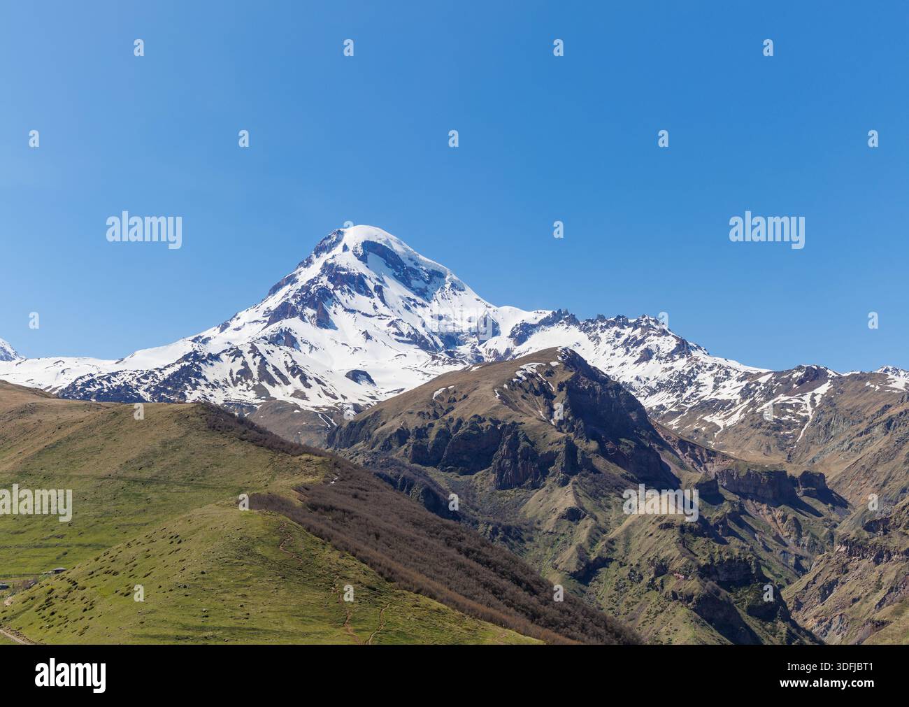 Scenic view of the Caucasus Mountains near the Gergeti Trinity Church ...