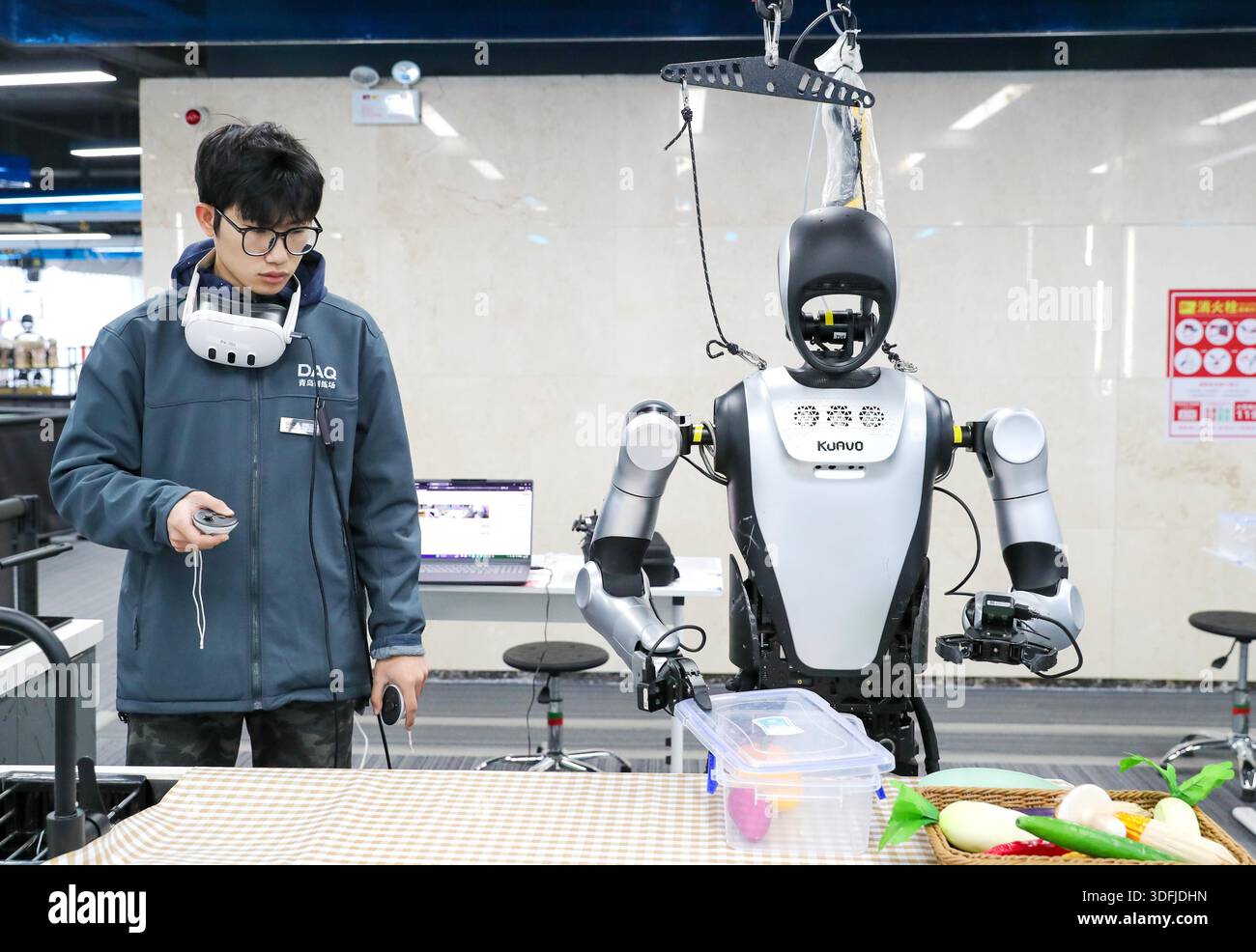 Robots practice grasping objects at a humanoid robot data collection ...