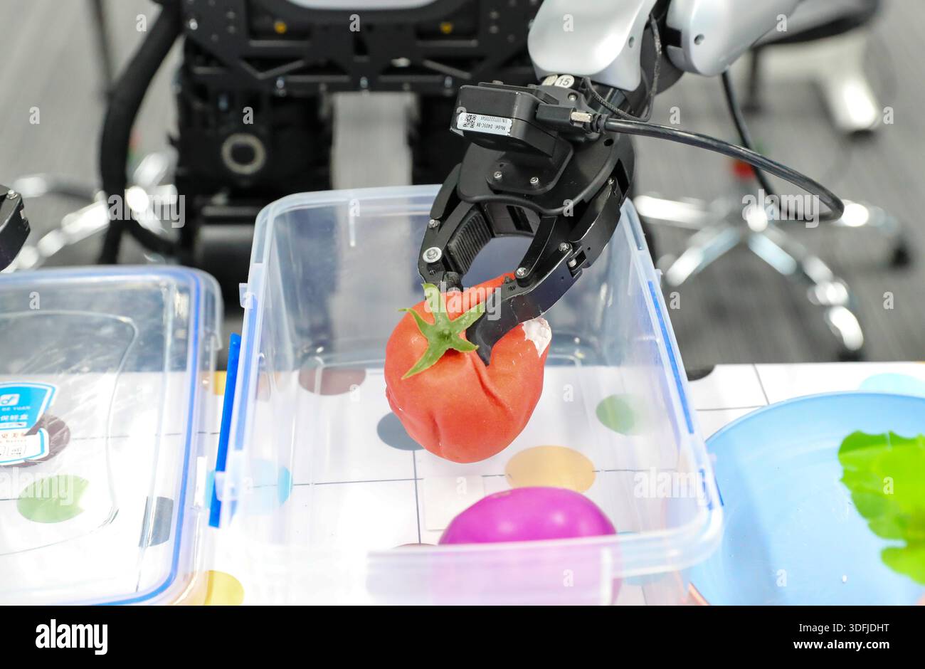 Robots practice grasping objects at a humanoid robot data collection ...