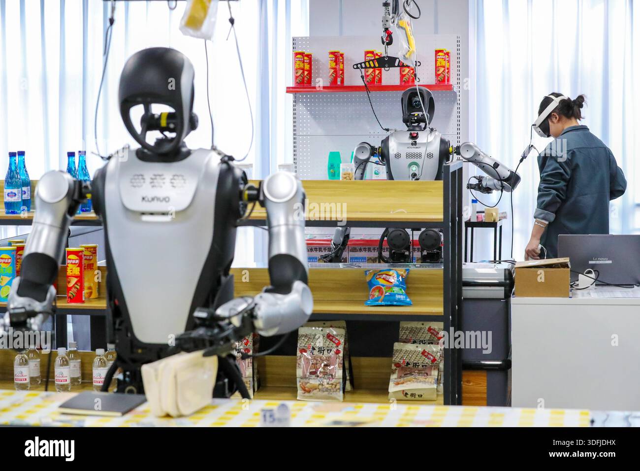 Robots practice grasping objects at a humanoid robot data collection ...