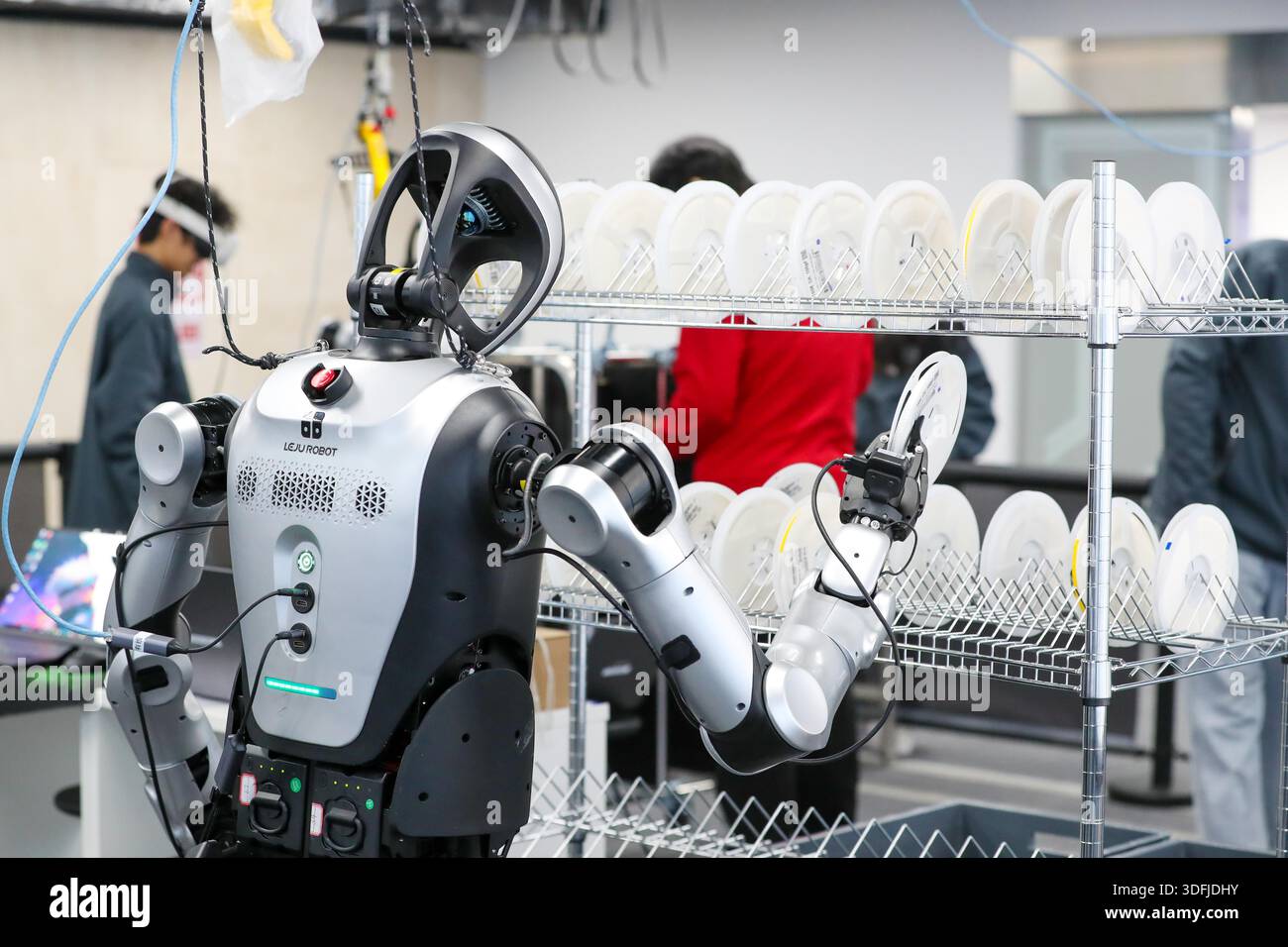 Robots practice grasping objects at a humanoid robot data collection ...