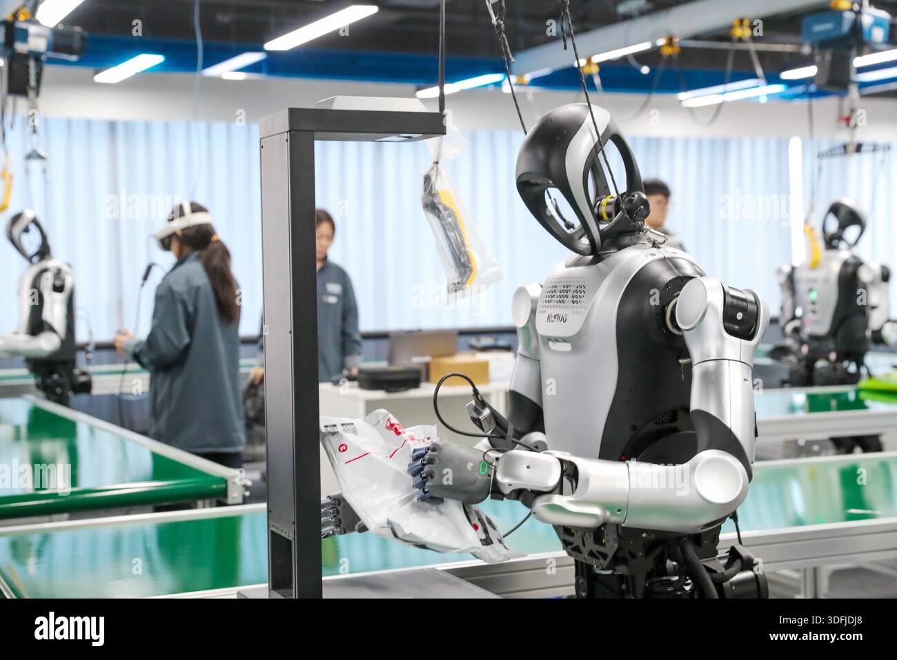 Robots practice grasping objects at a humanoid robot data collection ...