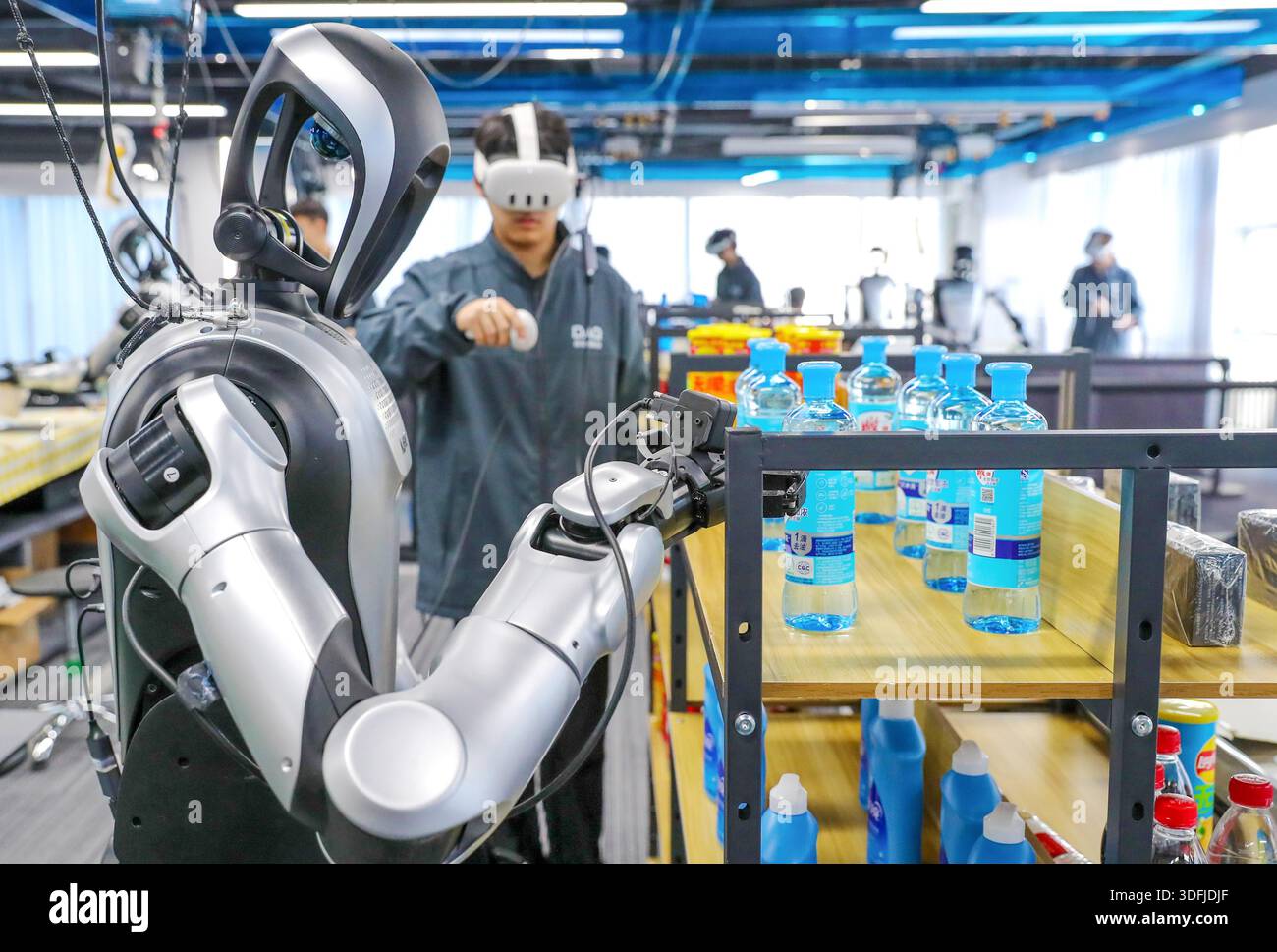 Robots practice grasping objects at a humanoid robot data collection ...
