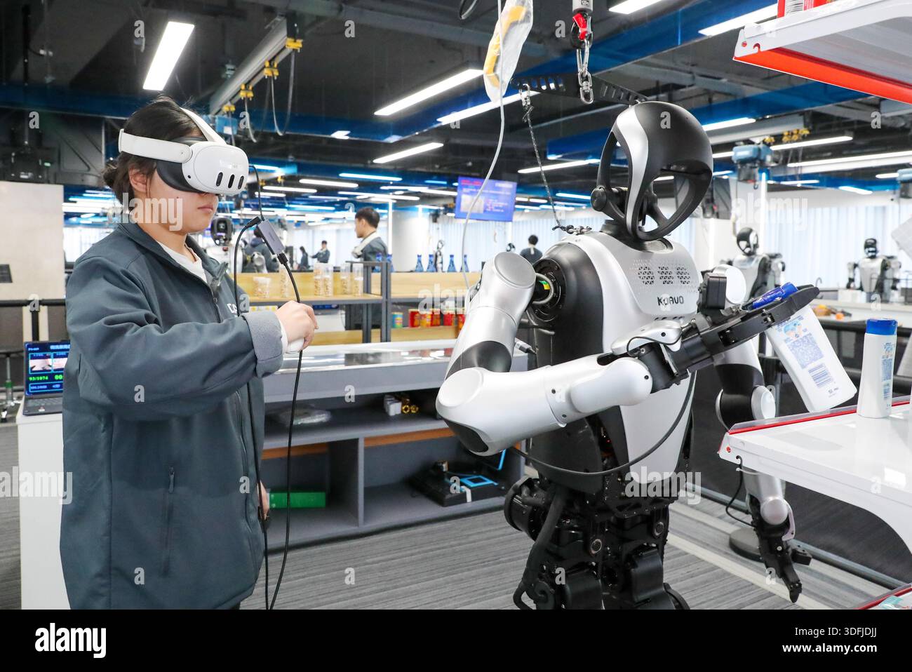 Robots practice grasping objects at a humanoid robot data collection ...
