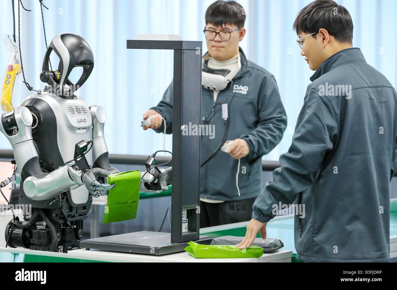 Robots practice grasping objects at a humanoid robot data collection ...