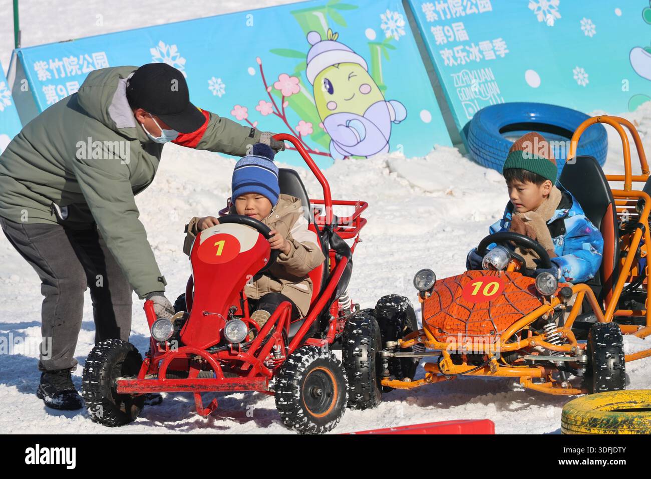 Children and parents enjoy snow activities during the Ice and Snow ...