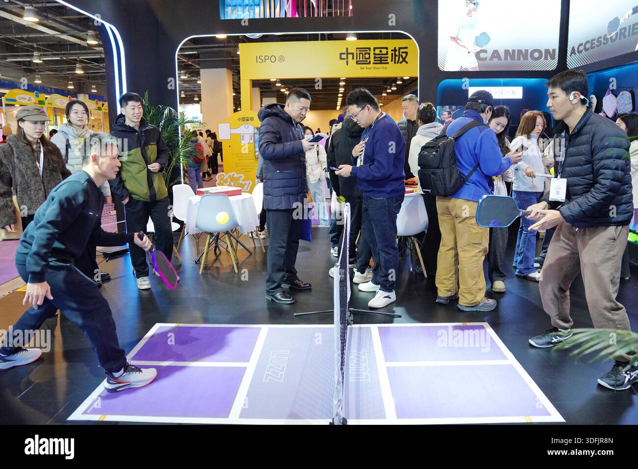 People visit the ISPO Beijing 2026 exhibition in Beijing, China, 10 ...