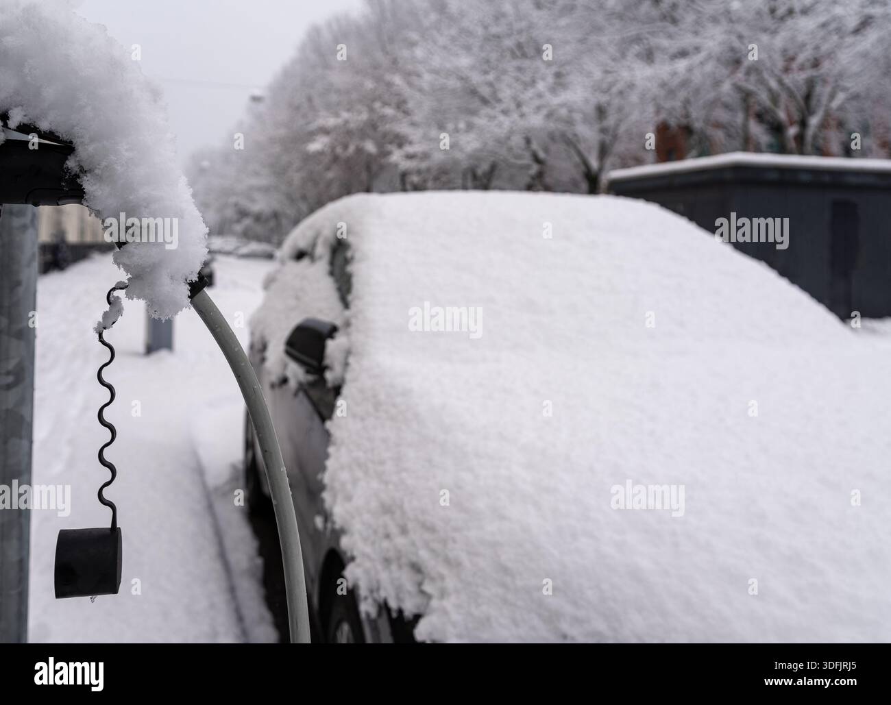 Electric Car and Charging Station Covered in Snow, Electric ...