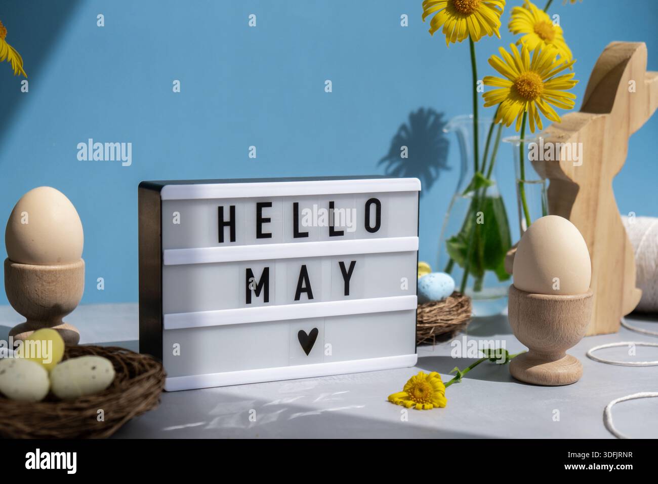 HELLO MAY text on Lightbox with bunny wooden figures eggs and fresh ...