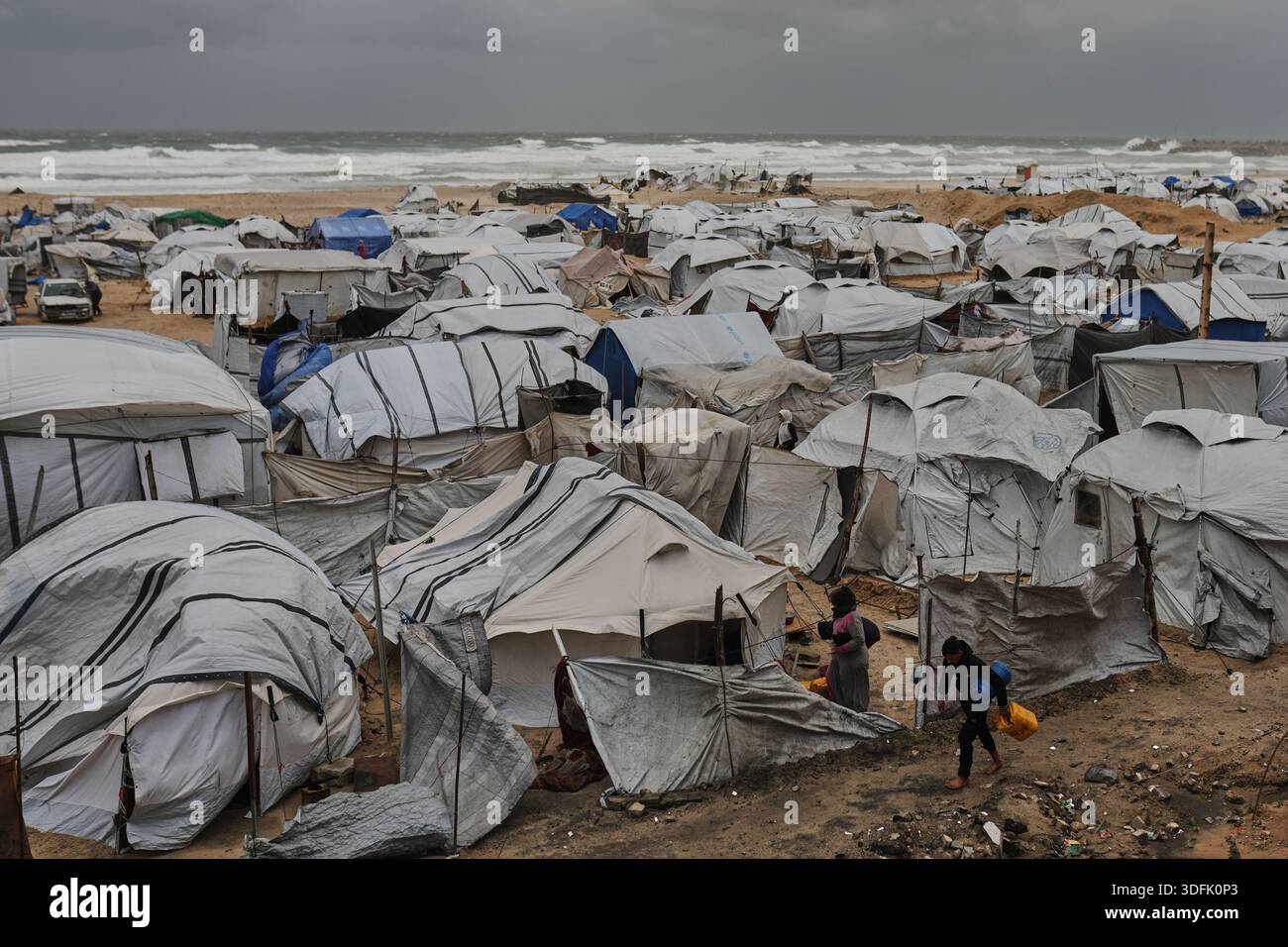 A view of a displacement camp sheltering Palestinians on a beach amid ...