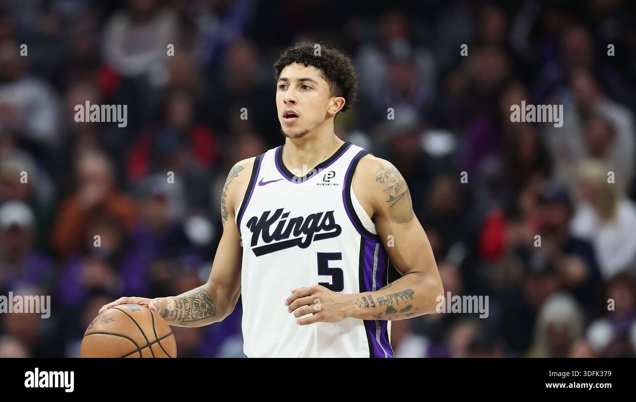 Sacramento Kings guard Nique Clifford dribbles upcourt during the first ...