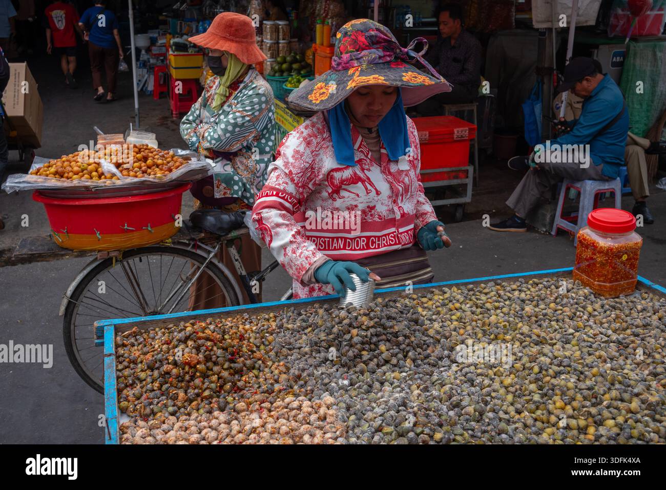 Vendors seen selling Ngov a local snack made of fermented blood cockles ...