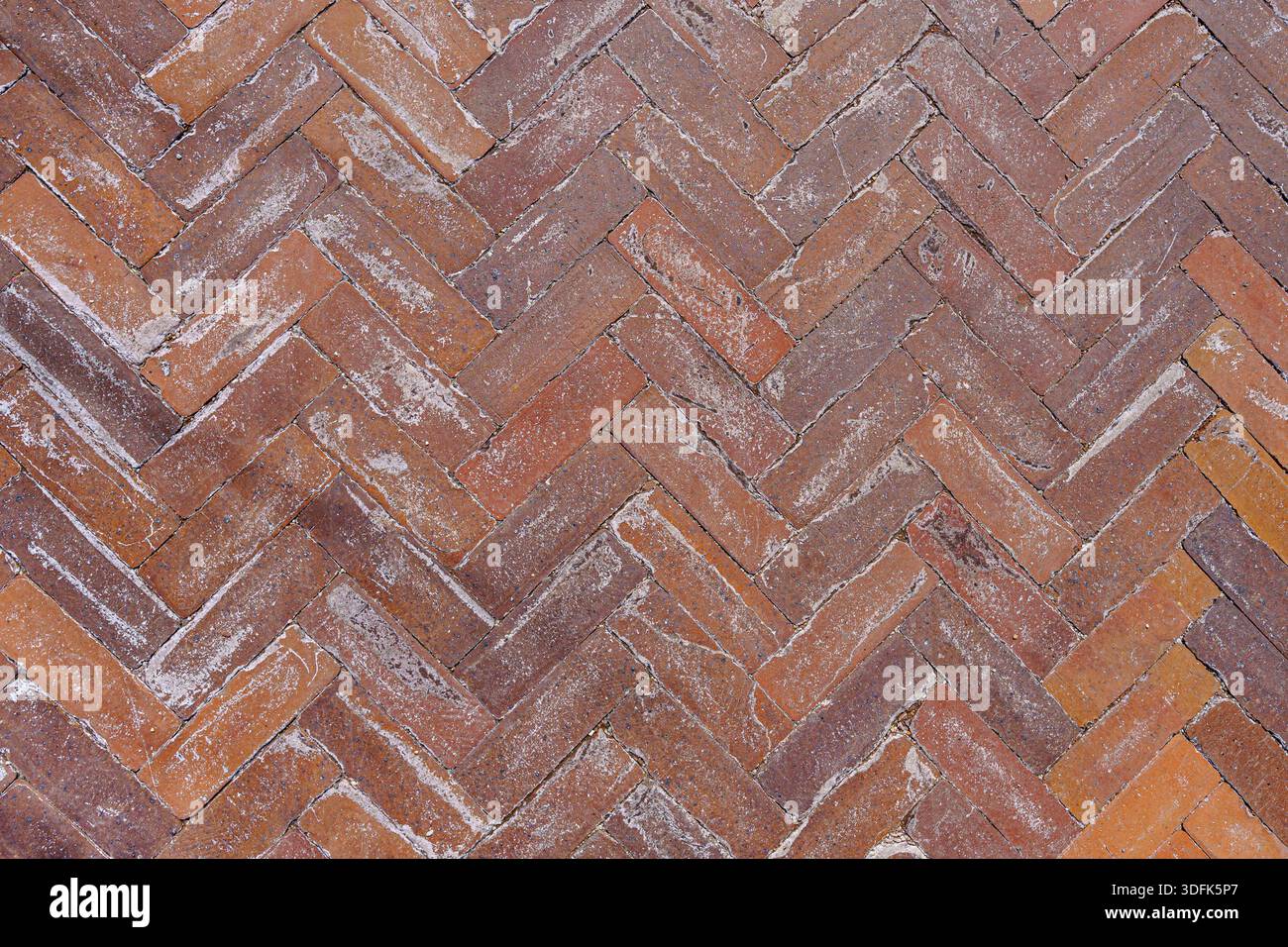 Worn tiled street surface. Abstract construction background Stock Photo ...