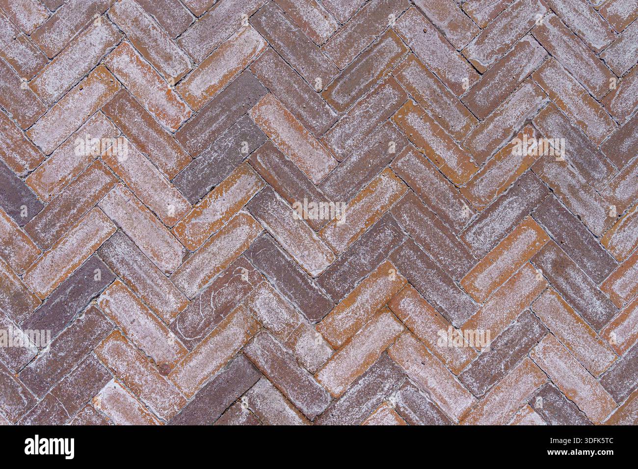 Worn tiled street surface. Abstract construction background Stock Photo ...