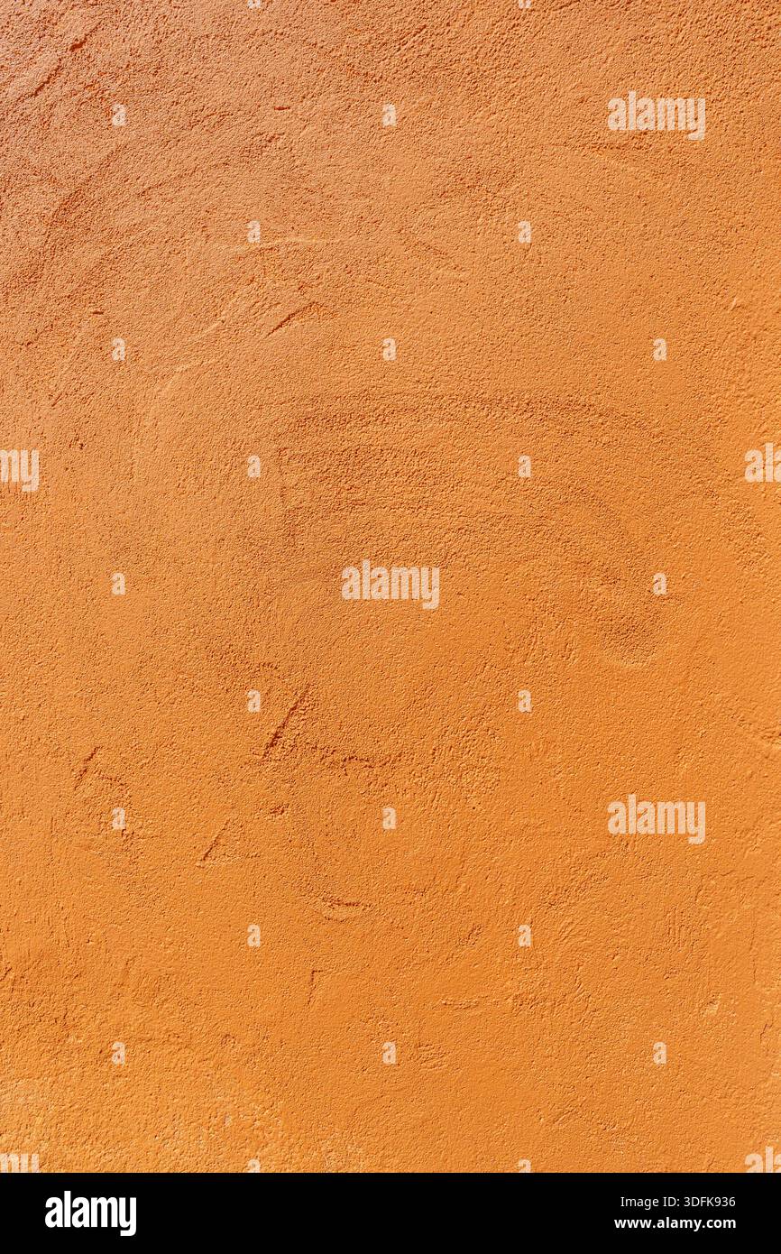 Texture of an old orange plastered wall. Abstract construction ...