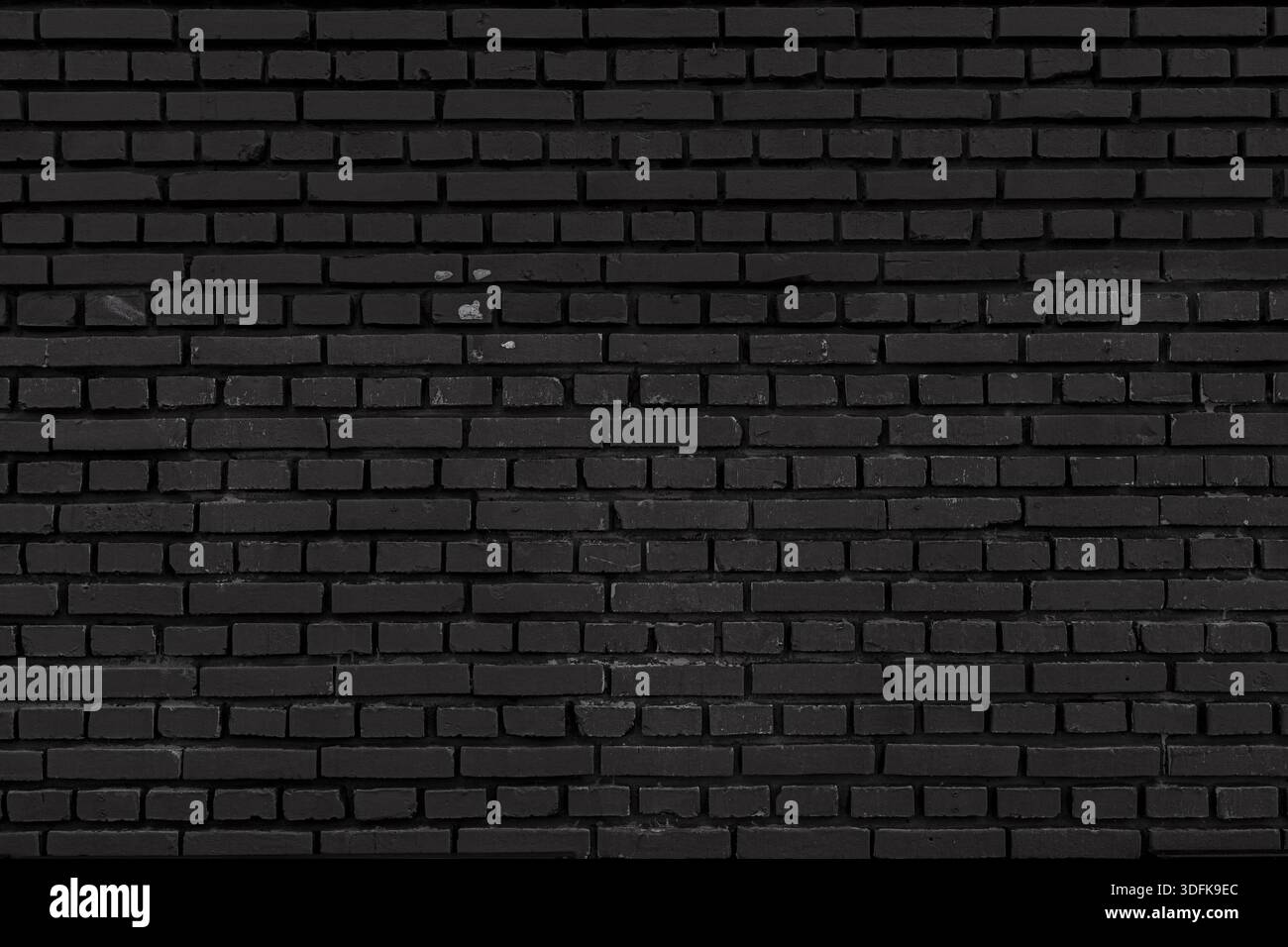 Old black brick wall. Abstract construction background Stock Photo - Alamy