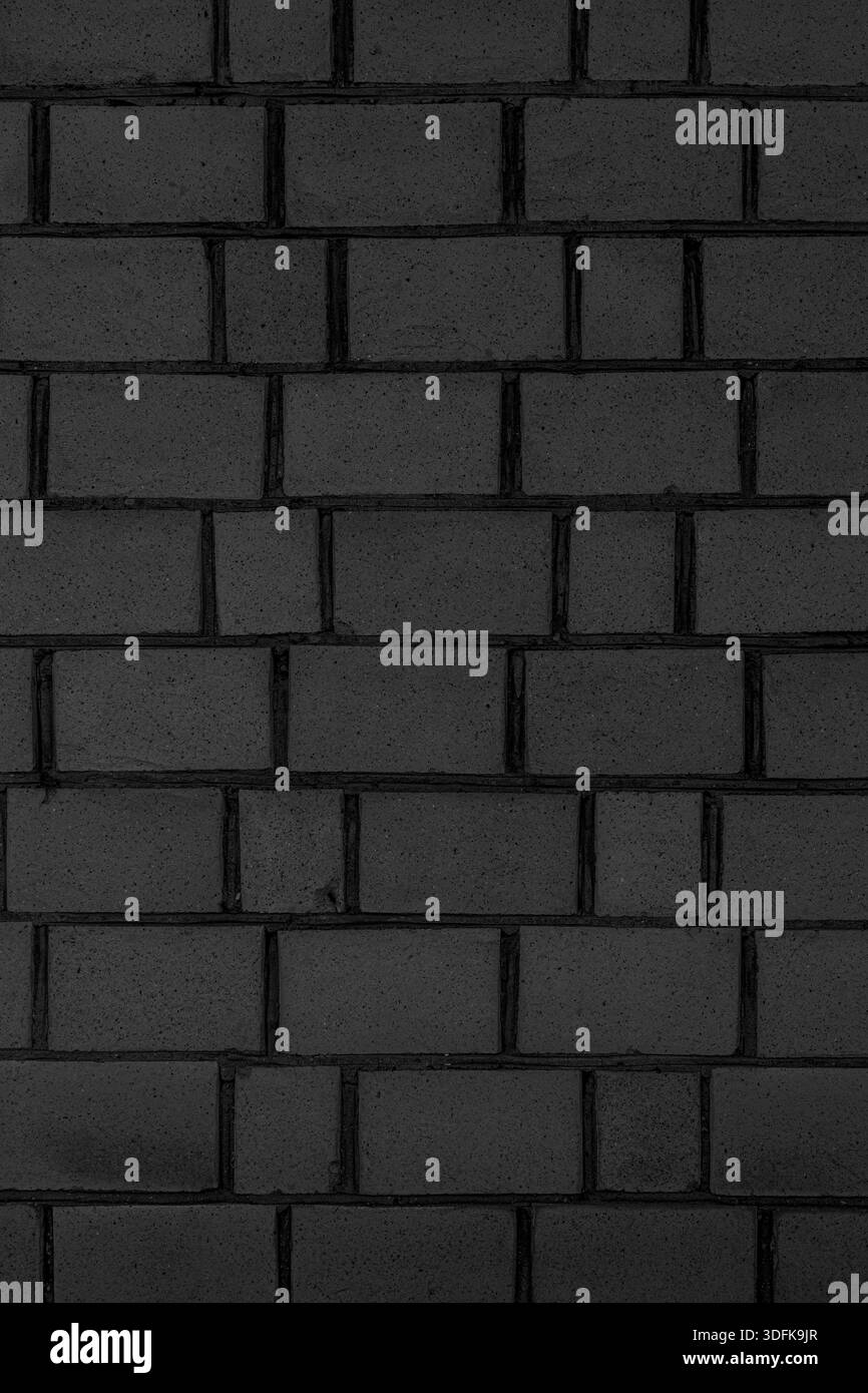 Old brick black wall. Abstract construction background Stock Photo - Alamy
