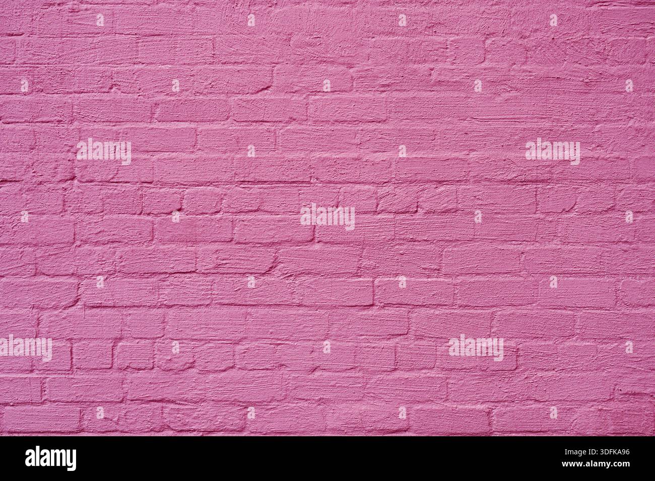 The brick wall is painted with pink paint. Abstract construction ...