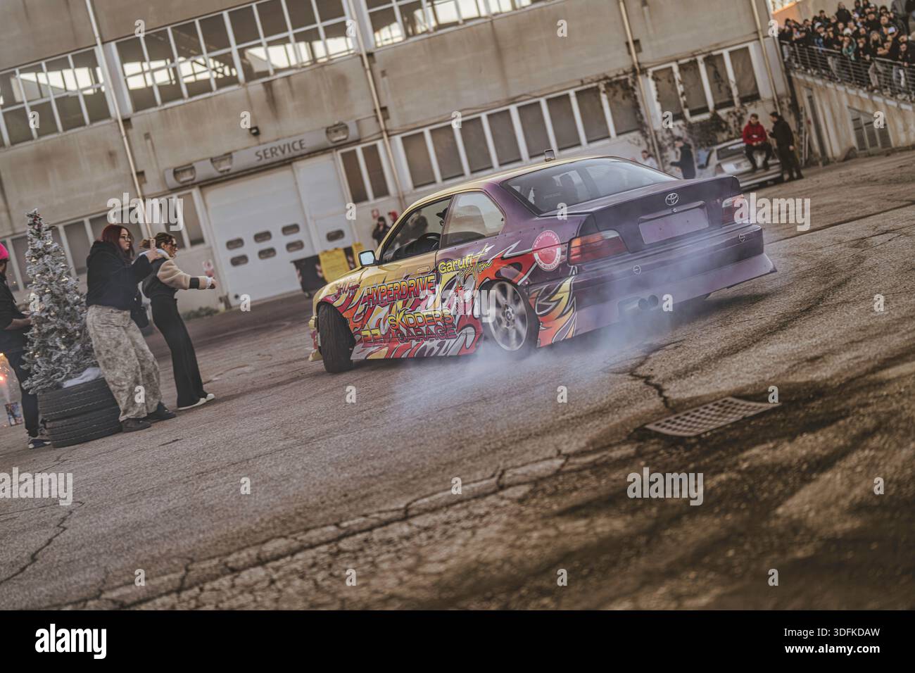 Imola, italy 01 january 2026: modified drift car generating smoke from ...