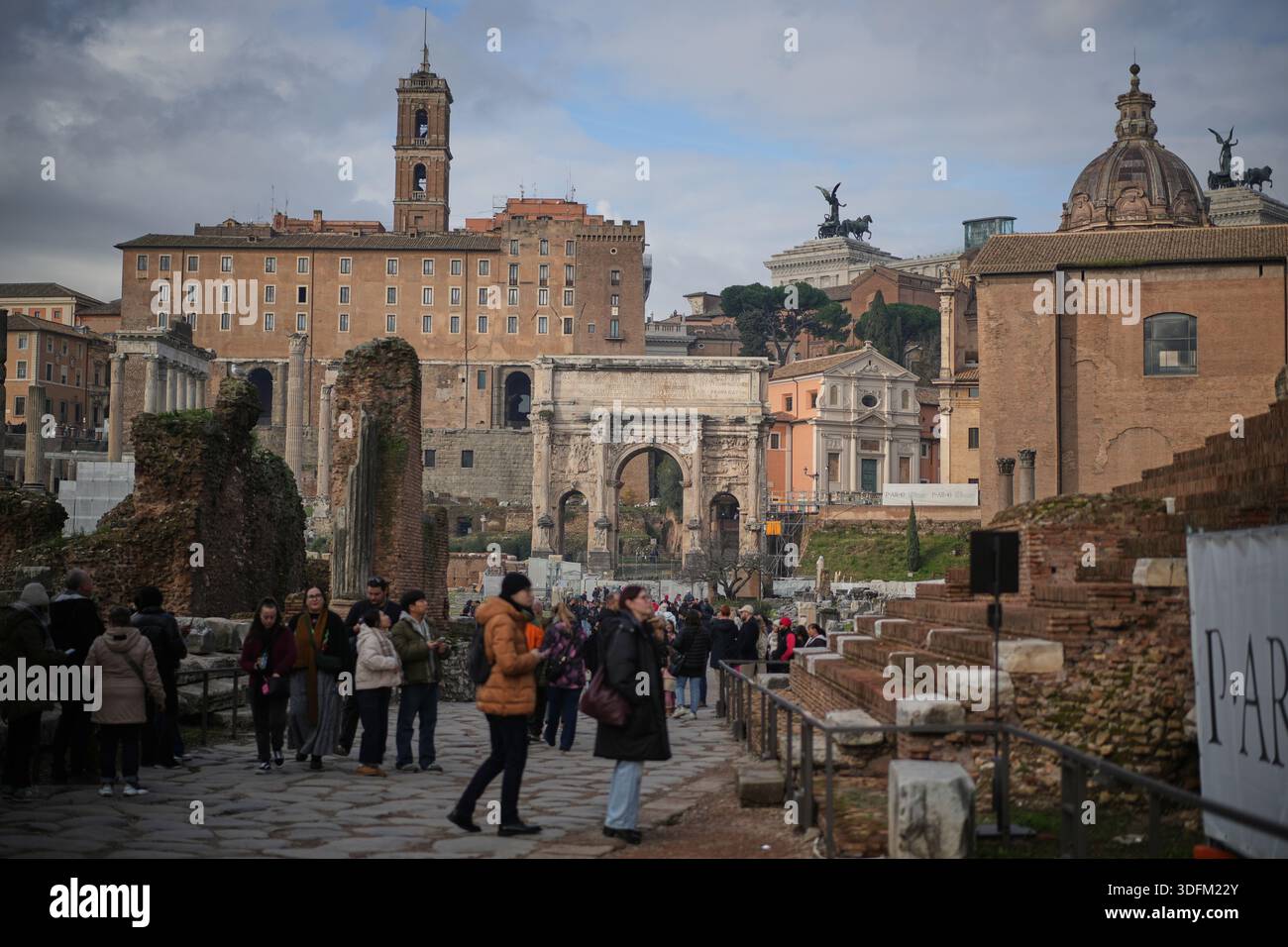 Visitors admire the Roman Forum, in Rome, Tuesday, Jan. 13, 2026. (AP ...