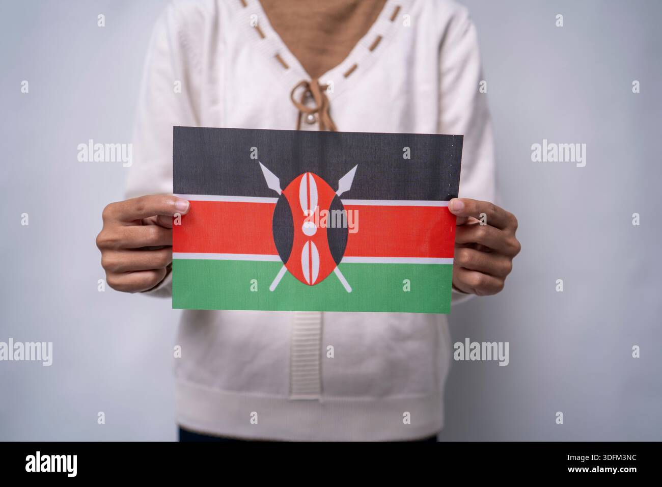 Hands Holding Flag of the Nation Kenya Stock Photo - Alamy