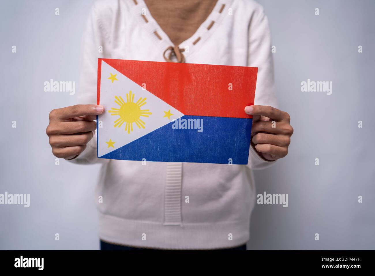 Hands Holding Flag of the Nation Philippines Stock Photo - Alamy