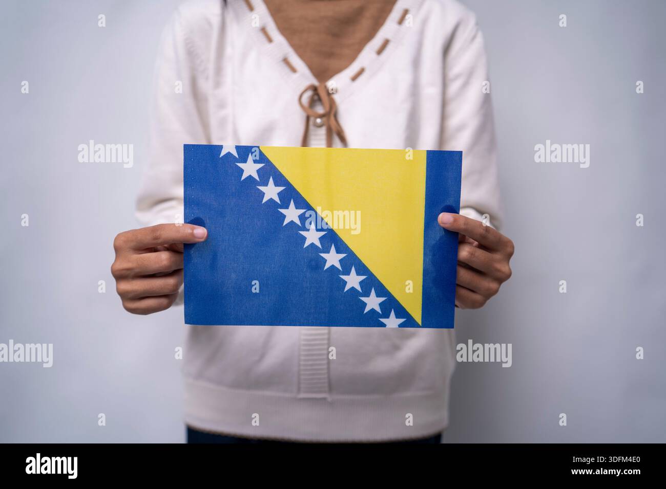 Hands Holding National Flag of Bosnia Stock Photo - Alamy