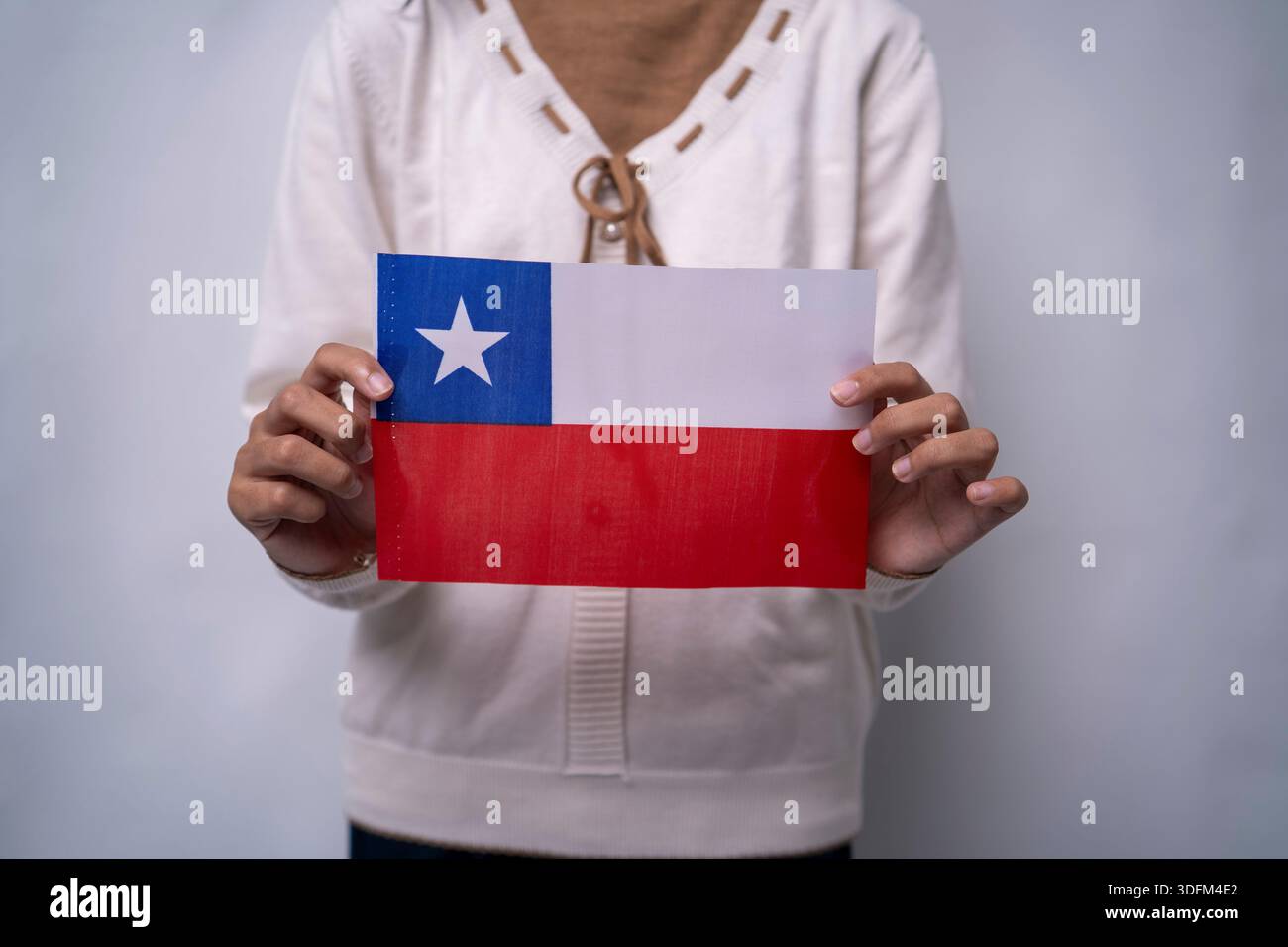 Hands Holding National Flag of Chile Stock Photo - Alamy